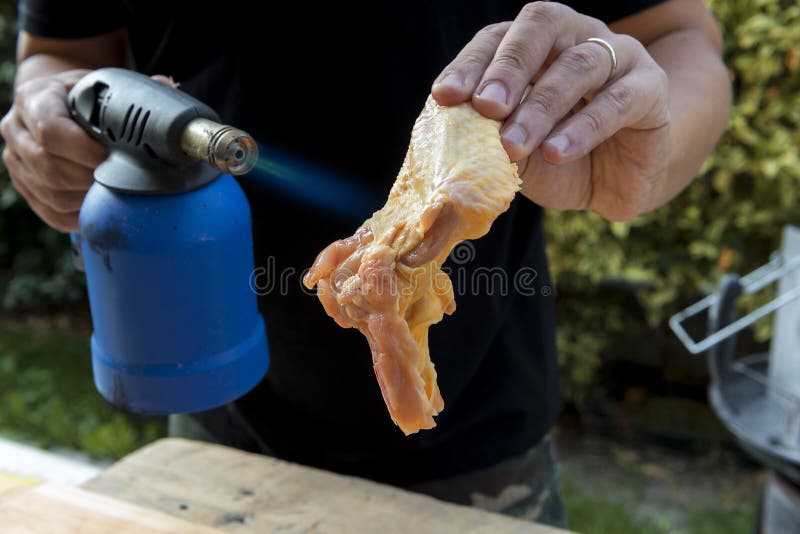 Cleaning Chicken Wings with Torch Stock Image - Image of ingredient ...
