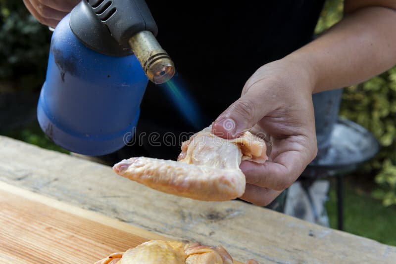 Cleaning Chicken Wings with Torch Stock Image - Image of ingredient ...