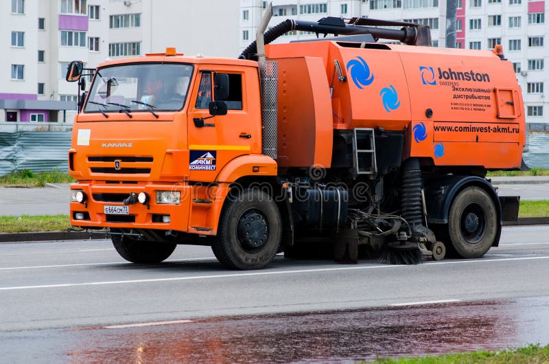 Cleaning of City Streets with a Special Orange Watering Machine ...