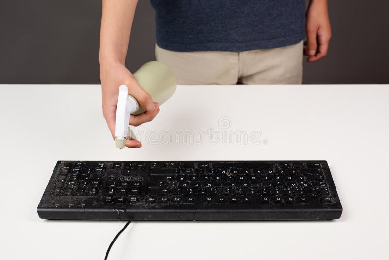Cleaning Computer Keyboard in Office, Spraying Water with a Spray ...