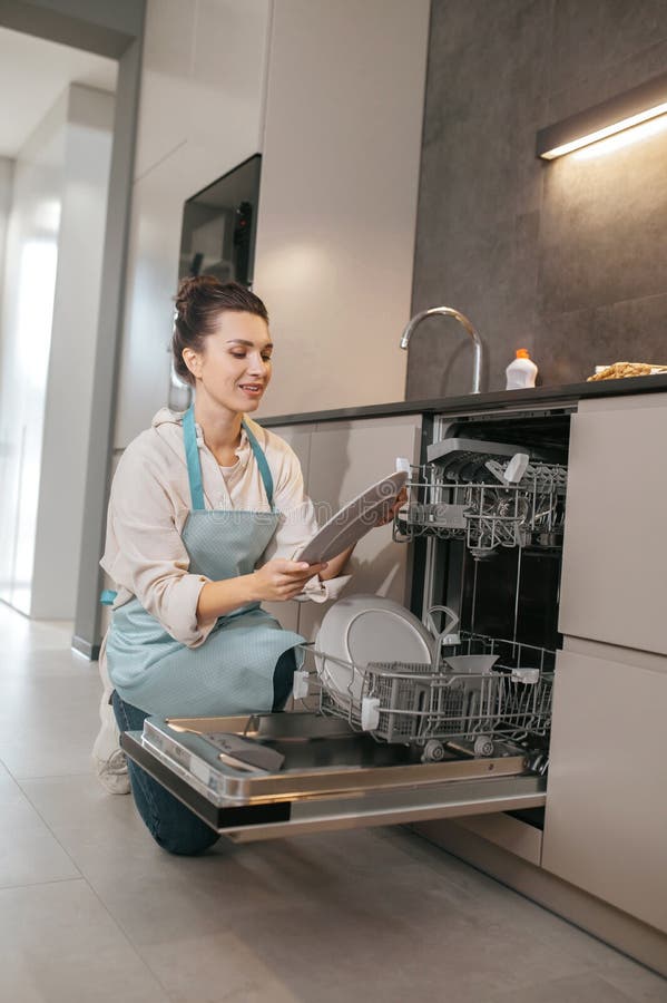 Young Woman in Apron Cleaning the Crockery Stock Photo - Image of ...