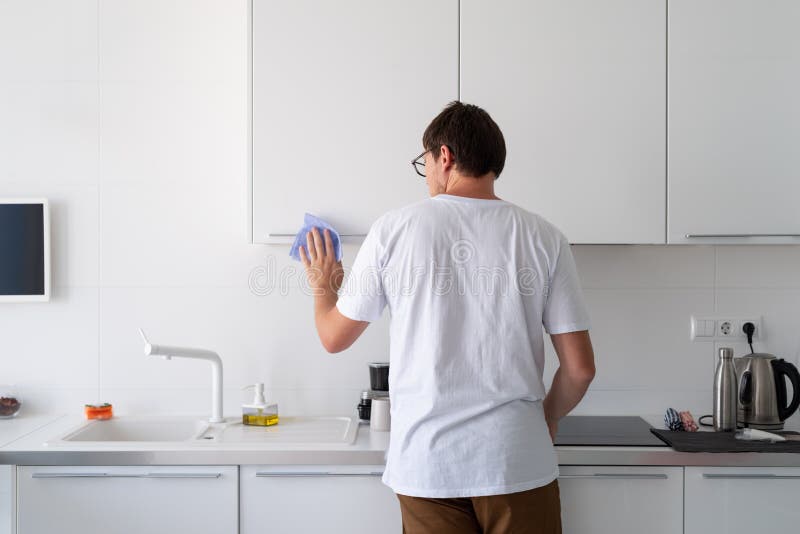 Man Cleaning the Kitchen Surfaces Stock Photo - Image of housekeeping ...