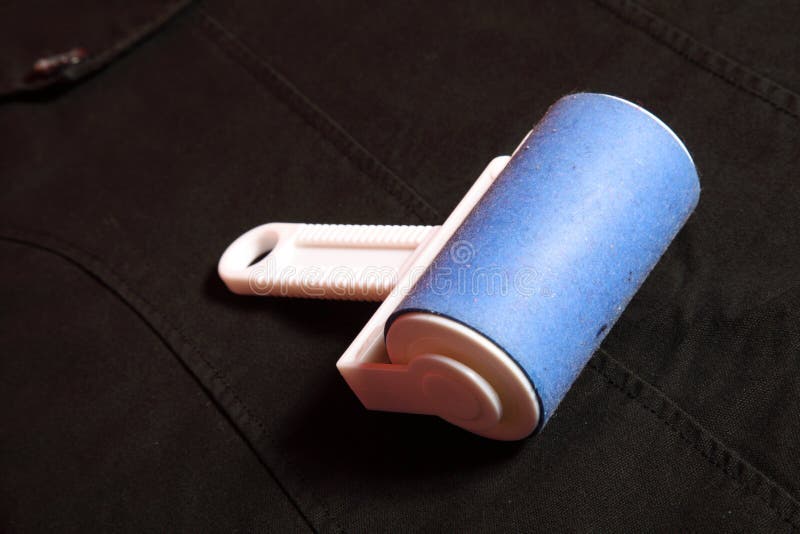 Cleaning Dust with Lint Roller Stock Photo - Image of clothes, roll ...