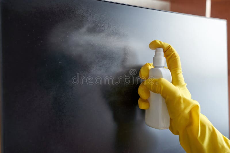 Cleaning a Dusty Tv Screen with Gloves and Spray Bottle for Optimal ...