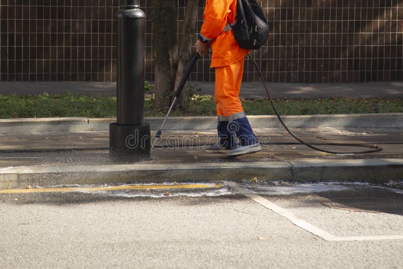 Cleaning of Footpaths by a Utility Worker Using Water and Shampoo Stock ...
