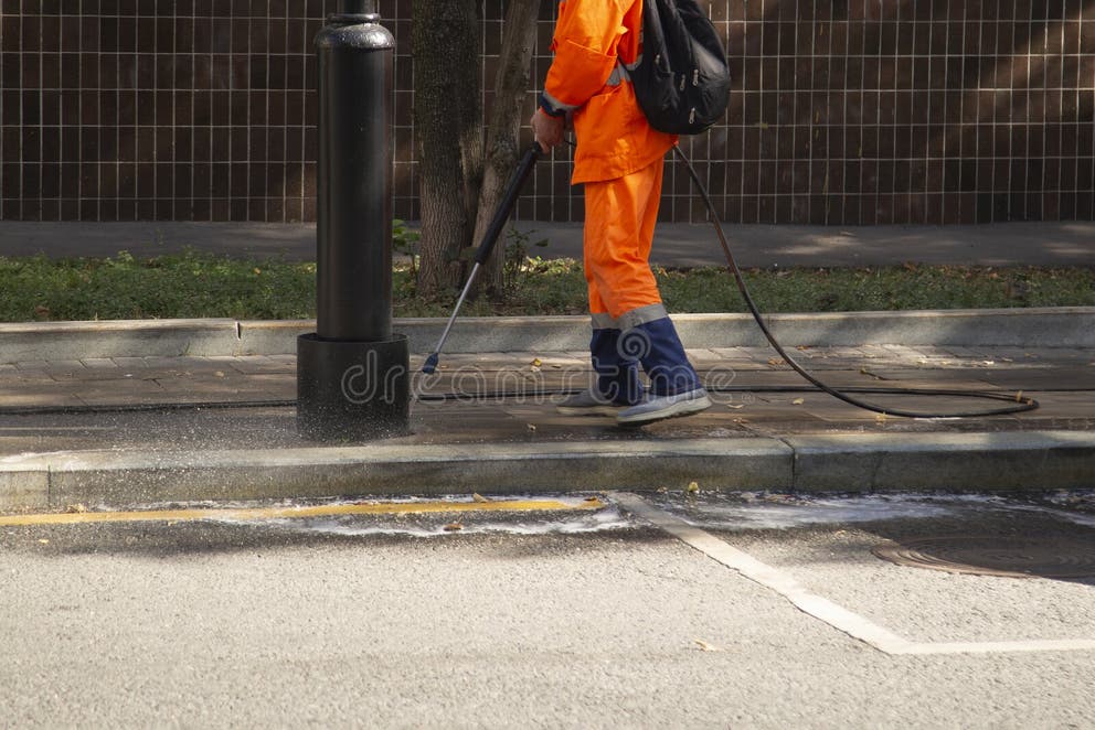 Cleaning of Footpaths by a Utility Worker Using Water and Shampoo Stock ...