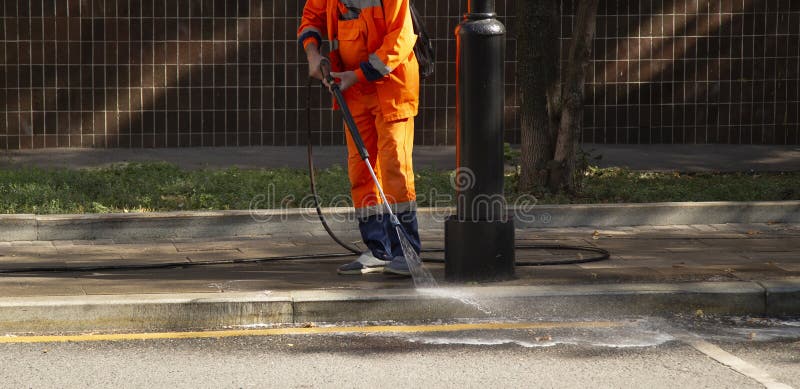 Cleaning of Footpaths by a Utility Worker Using Water and Shampoo Stock ...