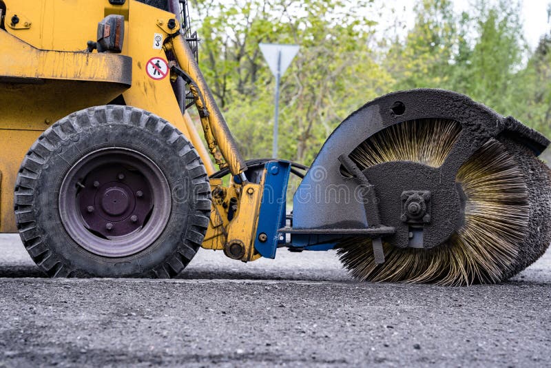 Cleaning of Garbage from the Road. a Rotating Mechanical Machine Brush ...