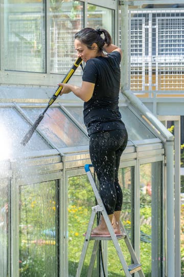 Cleaning of Glass Structures on the Terrace of the House Using Modern ...