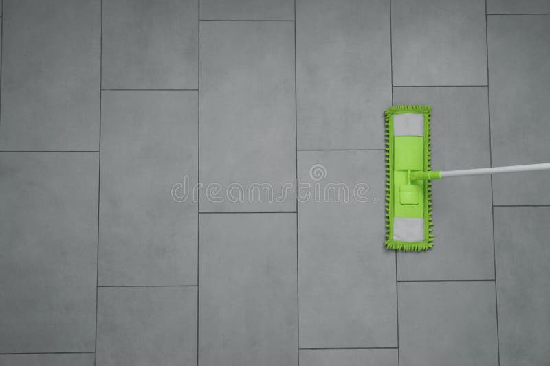 Cleaning Grey Tiled Floor with Microfiber Mop, Top View. Space for Text ...