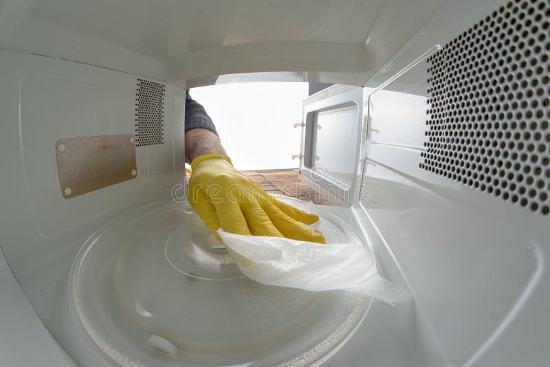 Cleaning the Inside of the Microwave in the Home Kitchen. the Device ...