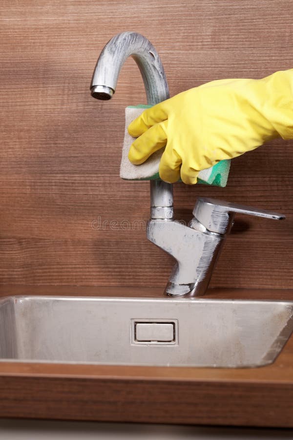 Cleaning kitchen tap stock photo. Image of protective - 63322178