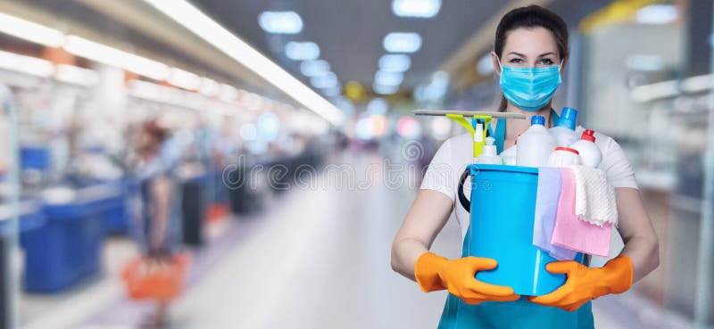 A Cleaning Lady Shows a Cleaning Tool and a Cleaning Agent Stock Photo ...