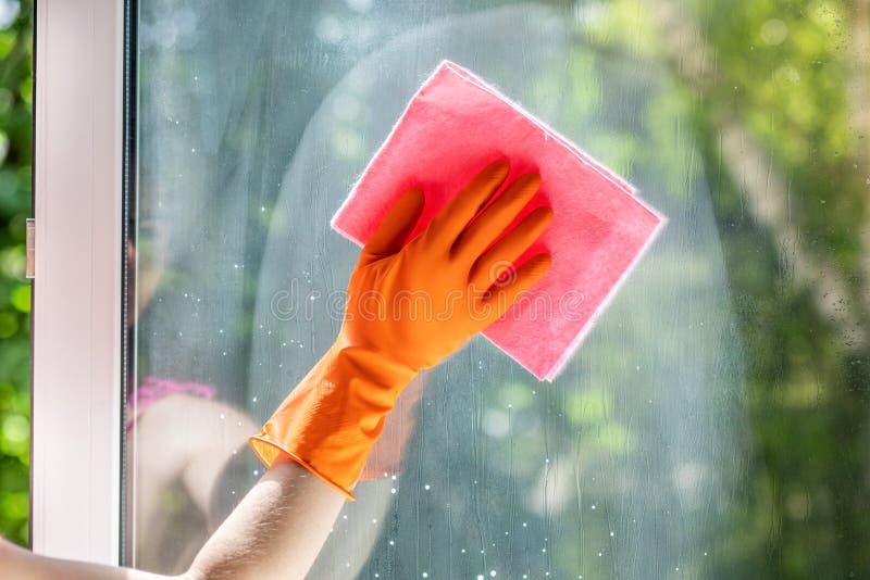 A Cleaning Lady Wipes the Glass with a Rag Stock Image - Image of ...