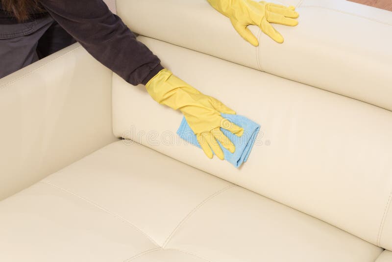 Cleaning Leather Sofa with Rag at the Home Stock Photo - Image of ...