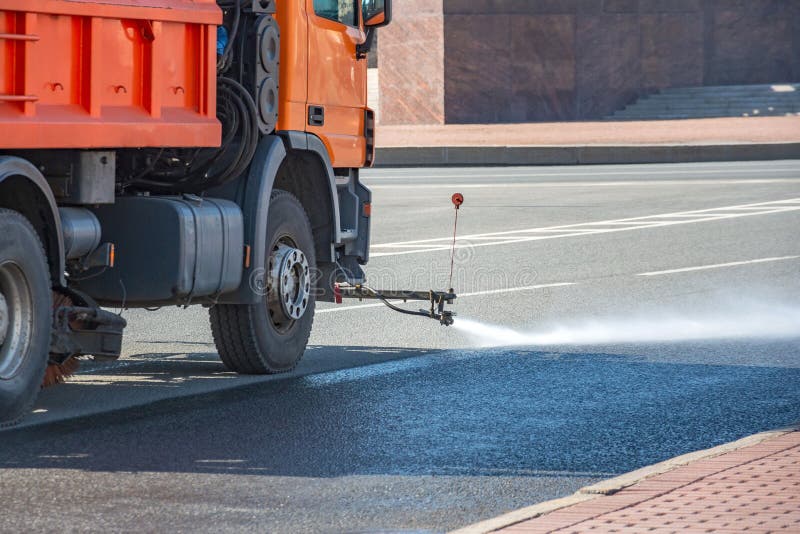 Cleaning Machine Washes Asphalt Road Surface the City Street, Close Up ...
