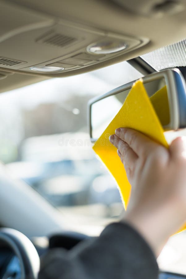 Cleaning mirror in a car stock image. Image of motion - 40260151