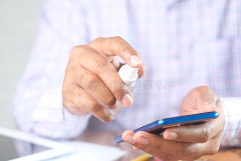 Cleaning Mobile Phone Display with Sanitizer Liquid Stock Photo - Image ...