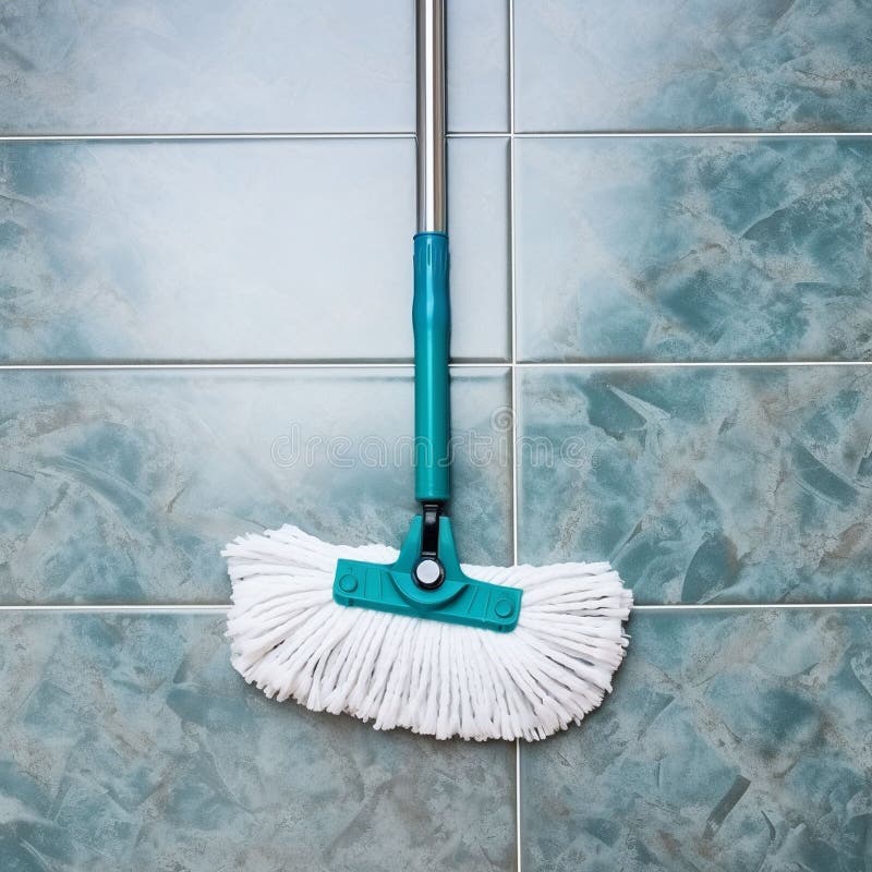 A Cleaning Mop Against a Polished Tile Wall, Showcasing a Fresh and ...