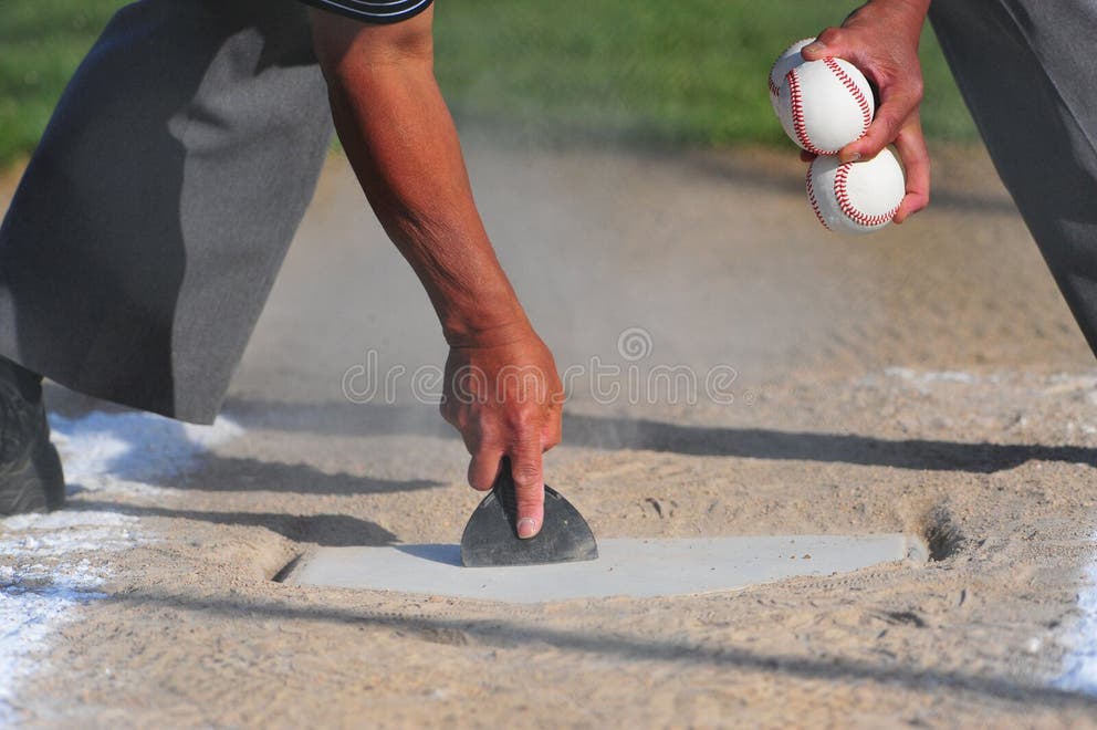 Cleaning off home plate stock photo. Image of sports, ball - 5116410