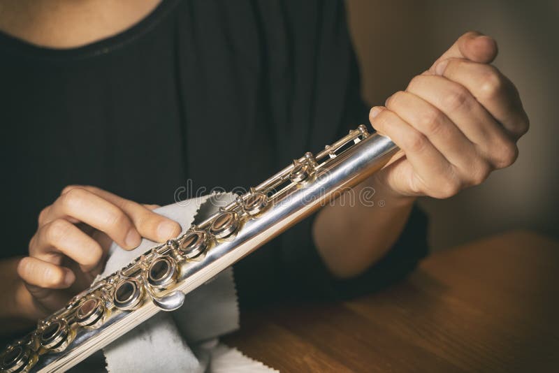 Cleaning and Polishing Flute with Rubbing Cloth Stock Image - Image of ...