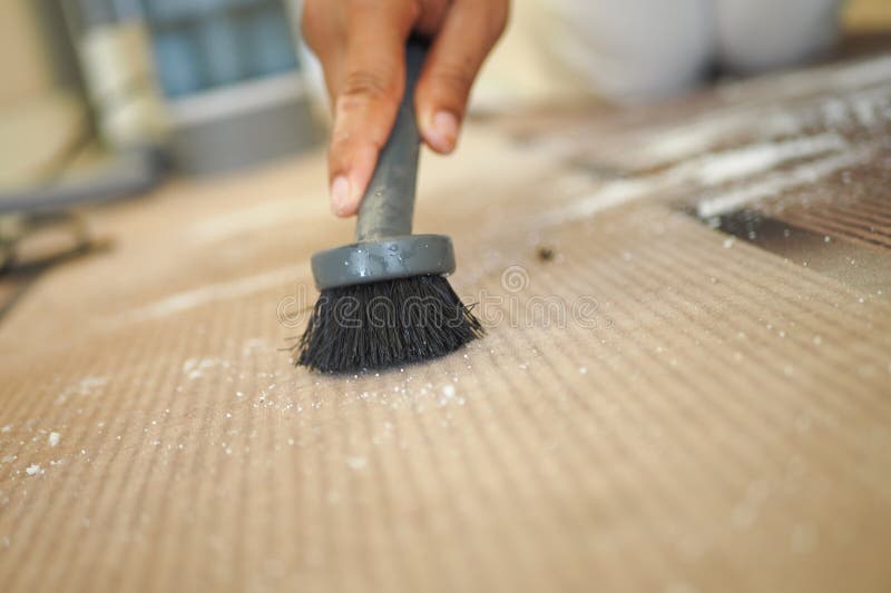 The Cleaning Process Involves the Thorough Sweeping Away of Dust Using ...