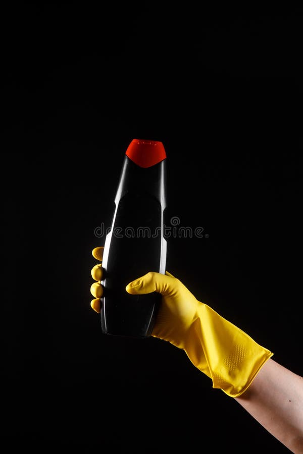 Cleaning Products, Black Rust Remover in Hands with Yellow Rubber ...