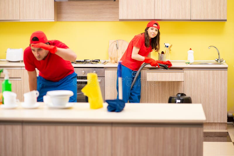 The Cleaning Professional Contractors Working at Kitchen Stock Image ...
