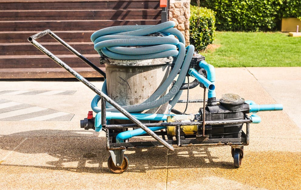 Cleaning Pump Working for a Swimming Pool Stock Photo - Image of grass ...