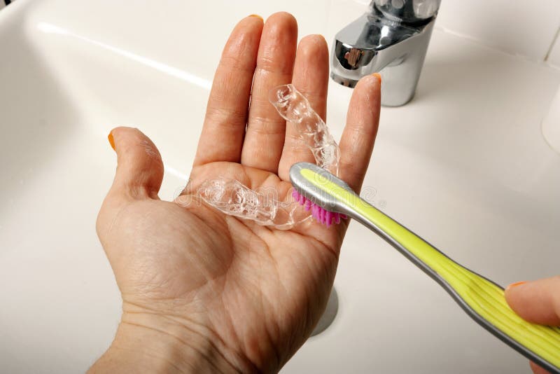 Cleaning of Retention Mouth Guards with Toothbrush Stock Photo - Image ...