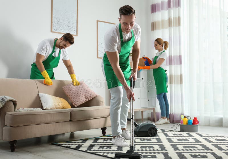 Cleaning Service Team at Work Stock Photo - Image of living, male ...