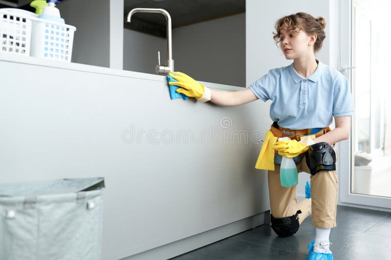 Cleaning Service Worker Wiping Dust in the Kitchen Stock Photo - Image ...