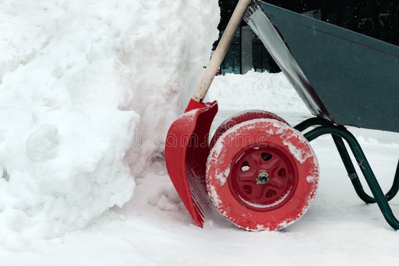 Cleaning Snow after a Blizzard with a Shovel. Shovel and Snow Stock ...