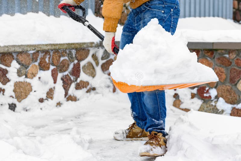 Cleaning Snow from Sidewalk and Using Snow Shovel. Stock Image - Image ...