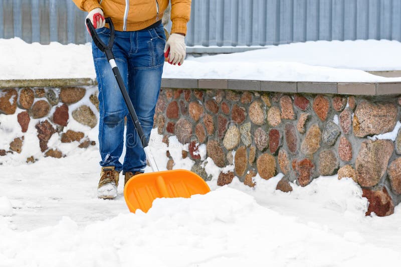 Cleaning Snow from Sidewalk and Using Snow Shovel. Stock Photo - Image ...