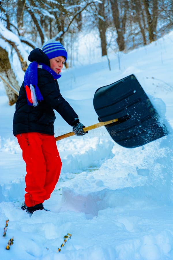 Cleaning Snow in Winter, the Boy Shovels Snow Stock Image - Image of ...