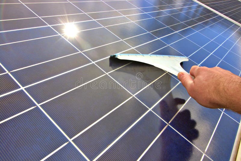 Cleaning solar panels stock image. Image of electricity - 256044335
