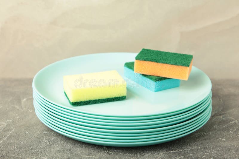 Cleaning Sponge with Plate on Grey Concrete Background. Top View Stock ...