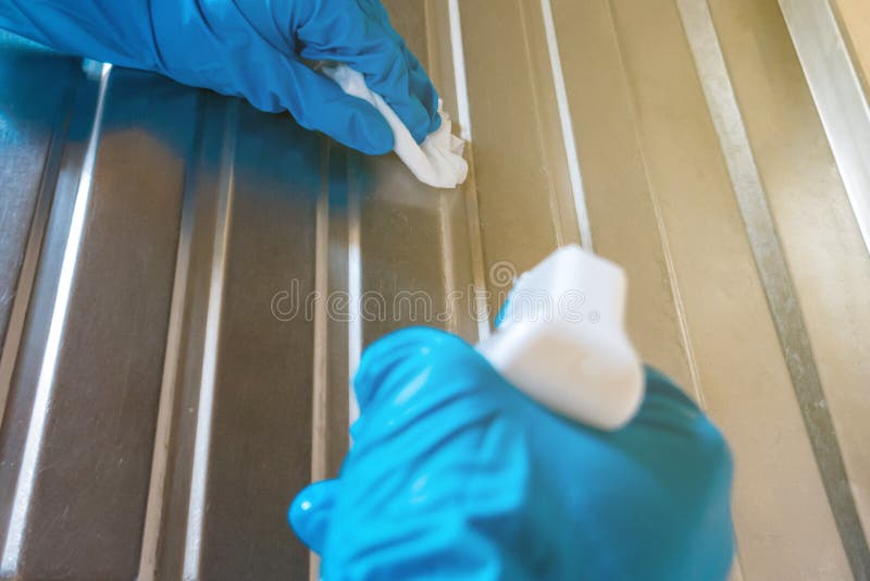 Cleaning with Spray Detergent, Rubber Gloves and Dish Cloth on Work ...