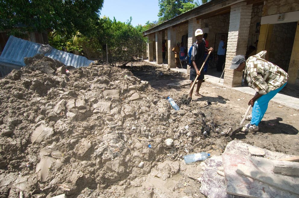 Cleaning Up the Aftermath editorial image. Image of tropical - 7516480