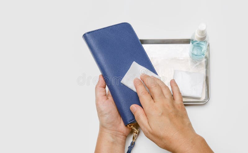 Cleaning Wallet with Alcohol To Protection from Covid-19 Stock Photo ...