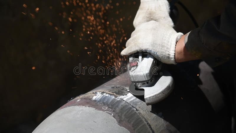 Cleaning of the Welding Seam after Welding Large Metal Pipes Stock ...