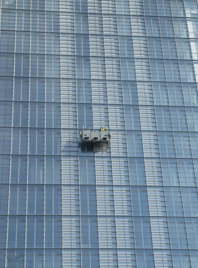 Cleaning the Windows of a Skyscraper with Cradle with Two People Stock ...