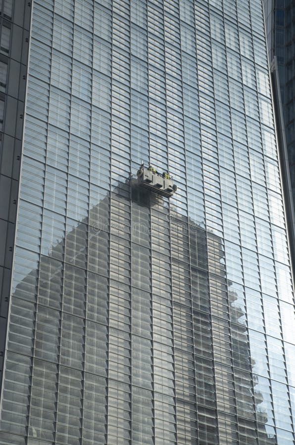 Cleaning the Windows of a Skyscraper with Cradle with Two People Stock ...