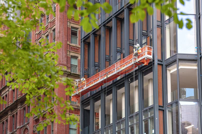 Cleaning the Windows of Some Tall Skyscraper Buildings. Workers are ...