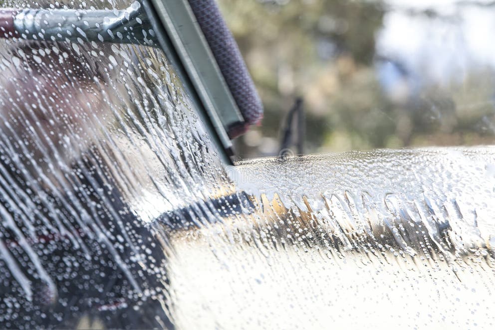 Cleaning the Windshield stock photo. Image of vehicle - 79184204