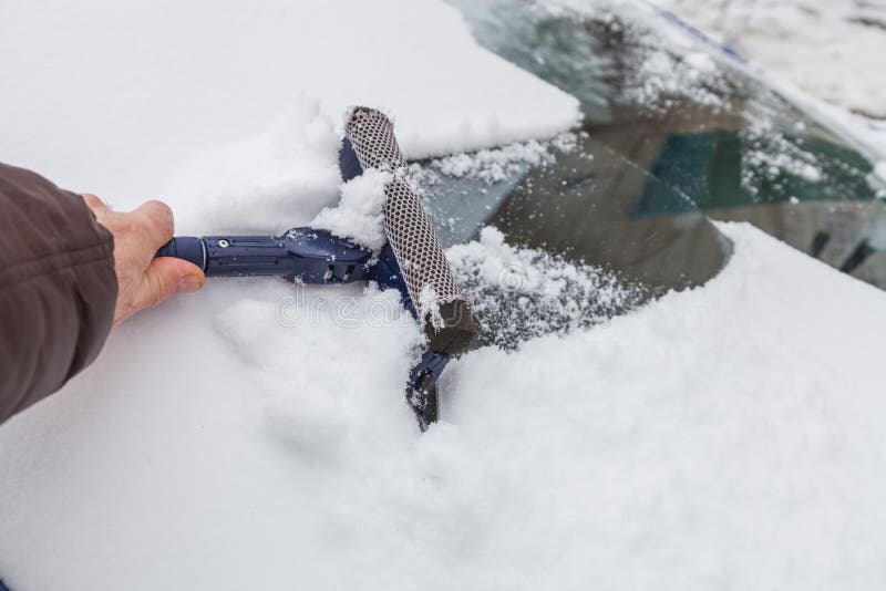 Cleaning Windshield from Snow with Scraper Stock Photo - Image of ...