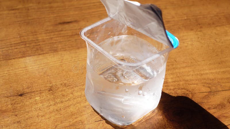 A Clear Water Container Inside a Plastic Bag Resting on a Beautiful ...