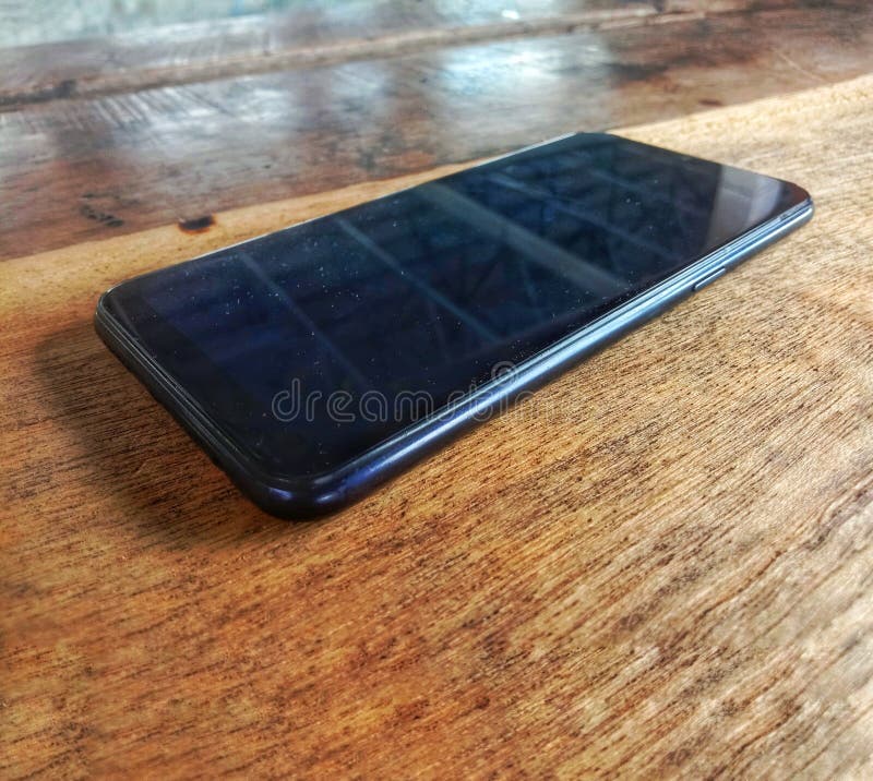 Clear Black Cell Phone, Reflected in the Roof& X27;s Shadow Stock Photo ...