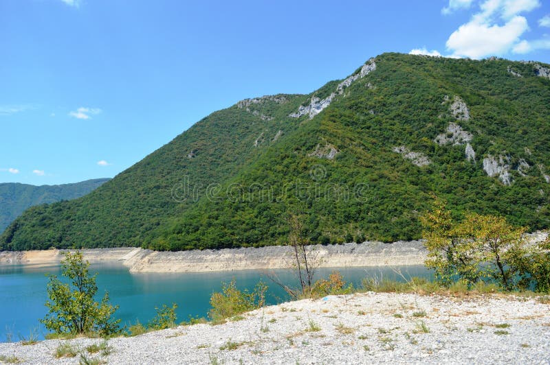 Clear blue mountain lake stock image. Image of vacation - 271785435